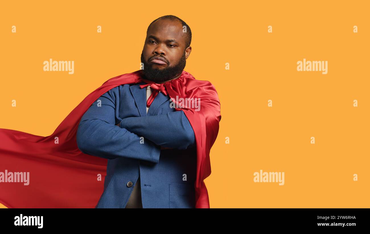 African american superhero flying with red cape, isolated over studio ...