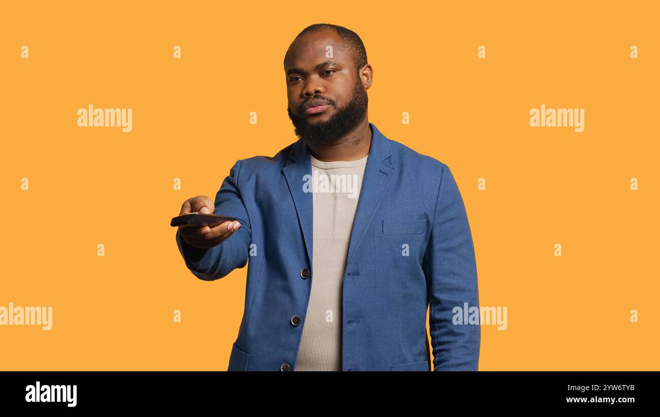 Man zapping through channels, watching news broadcast, isolated over ...