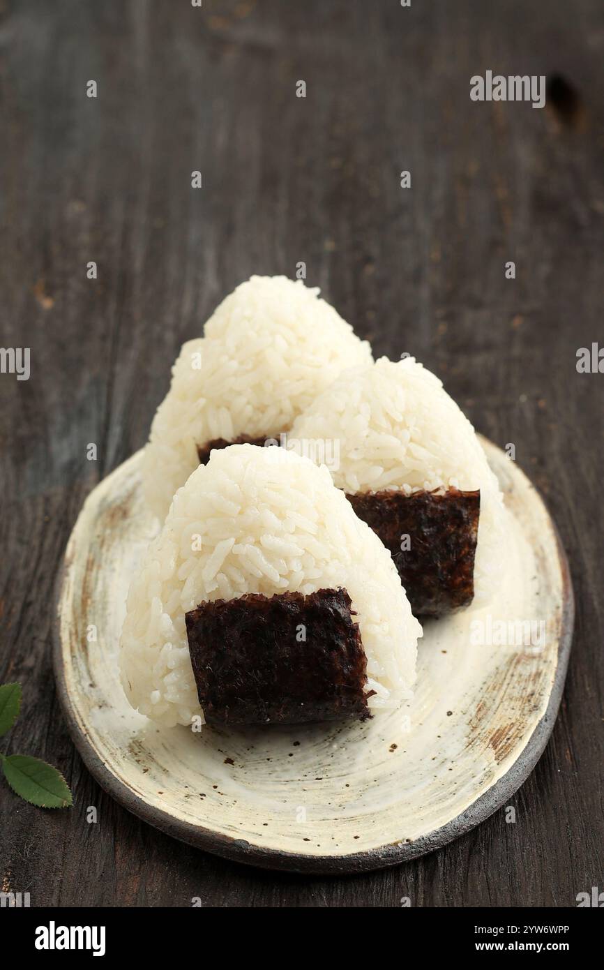 Homemade Onigiri or Japanese Rice Balls or Omusubi or Nigirimeshi, Triangle rice with Seaweed ...