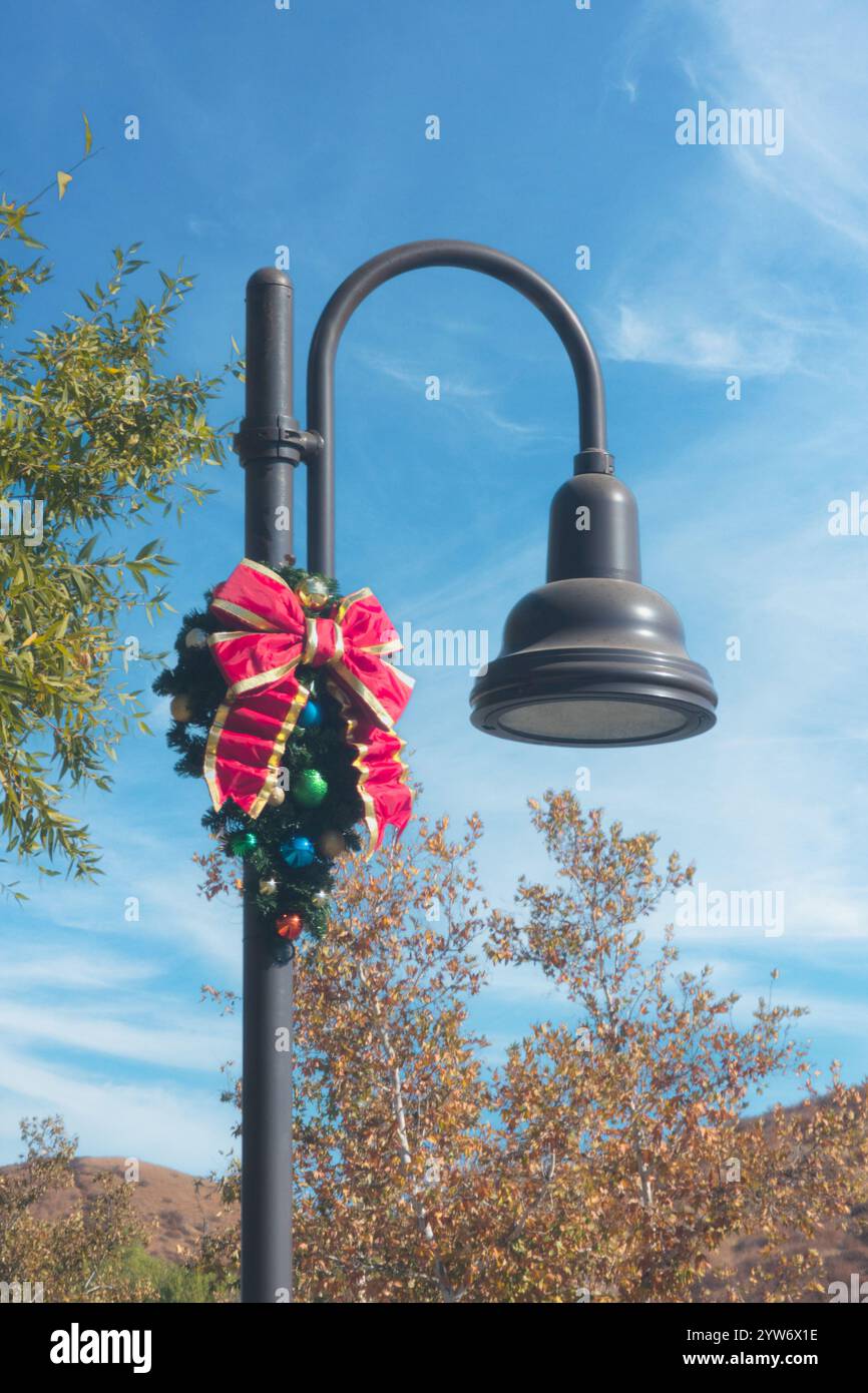 A Christmas decoration on a street light pole Stock Photo - Alamy