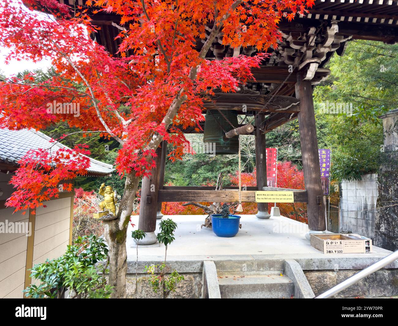 Japanese Bell Pavilion Framed by Brilliant Red Maple Leaves Stock Photo ...