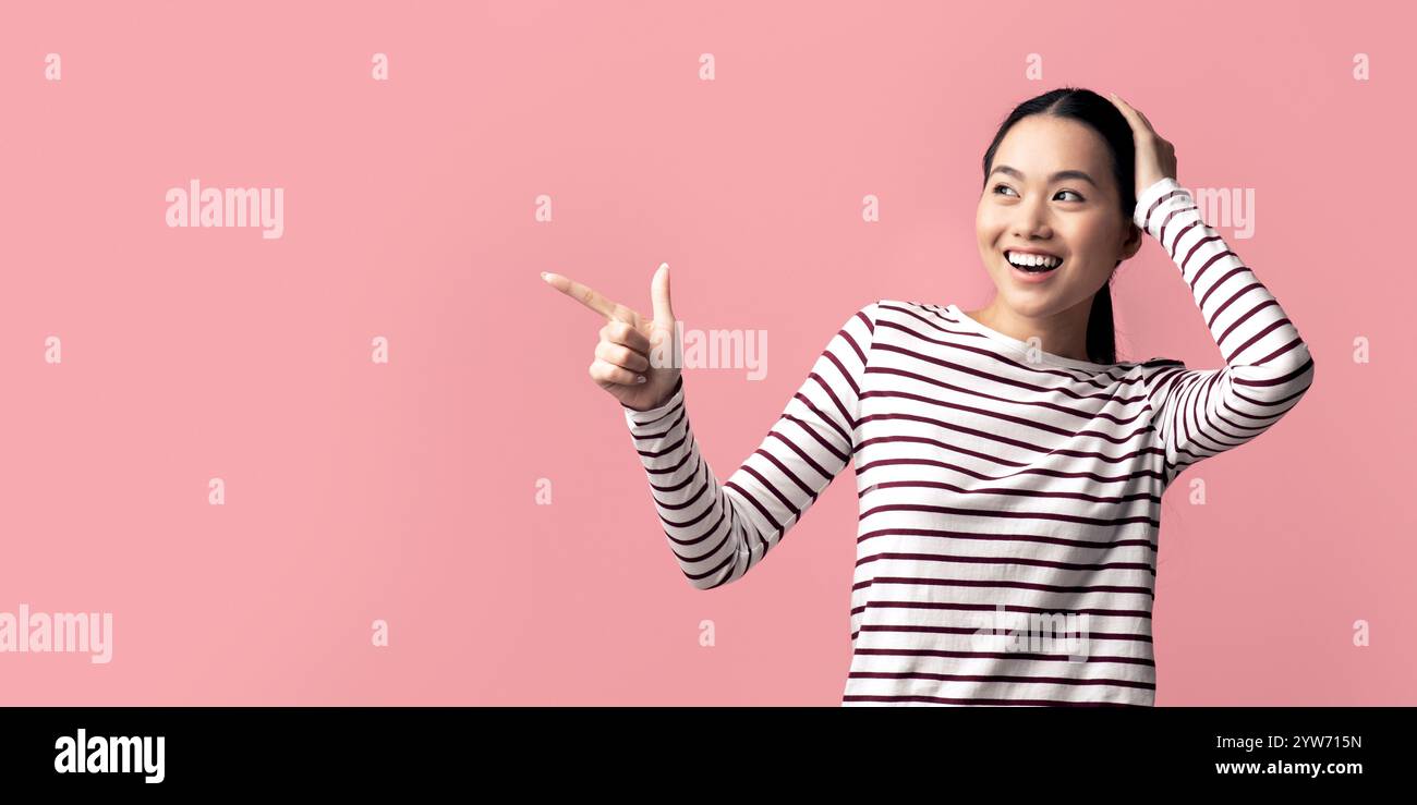 Joyful Young Korean Woman Pointing Aside At Copy Space With Finger ...