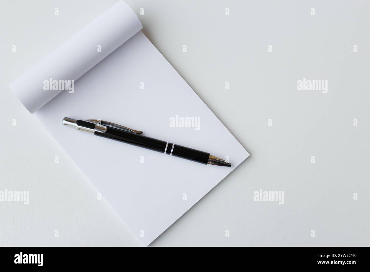 Black pen and white paper notepad banner background with copy space ...