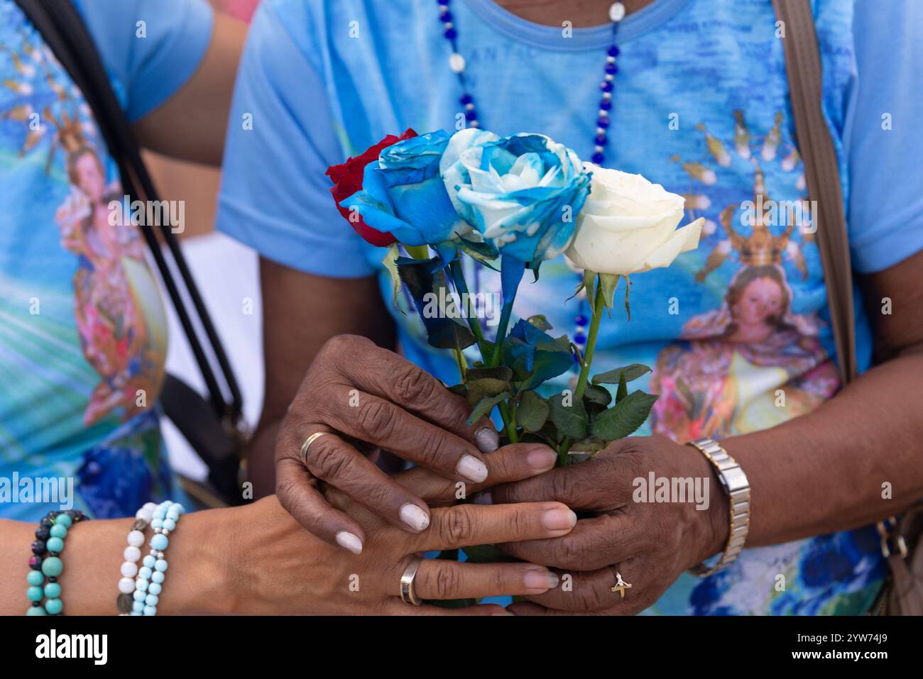 Salvador, Bahia, Brazil - December 08, 2024: Catholics are seen holding ...
