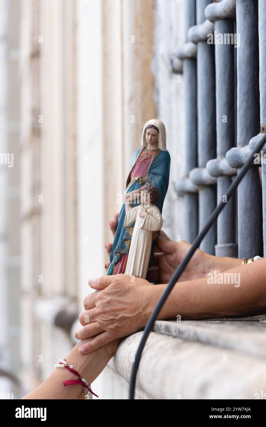Salvador, Bahia, Brazil - December 08, 2024: Catholics are seen holding ...