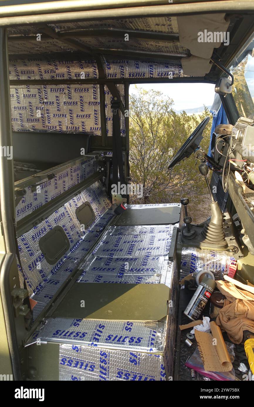 sound deadening panels being installed into a British Army Land Rover ...