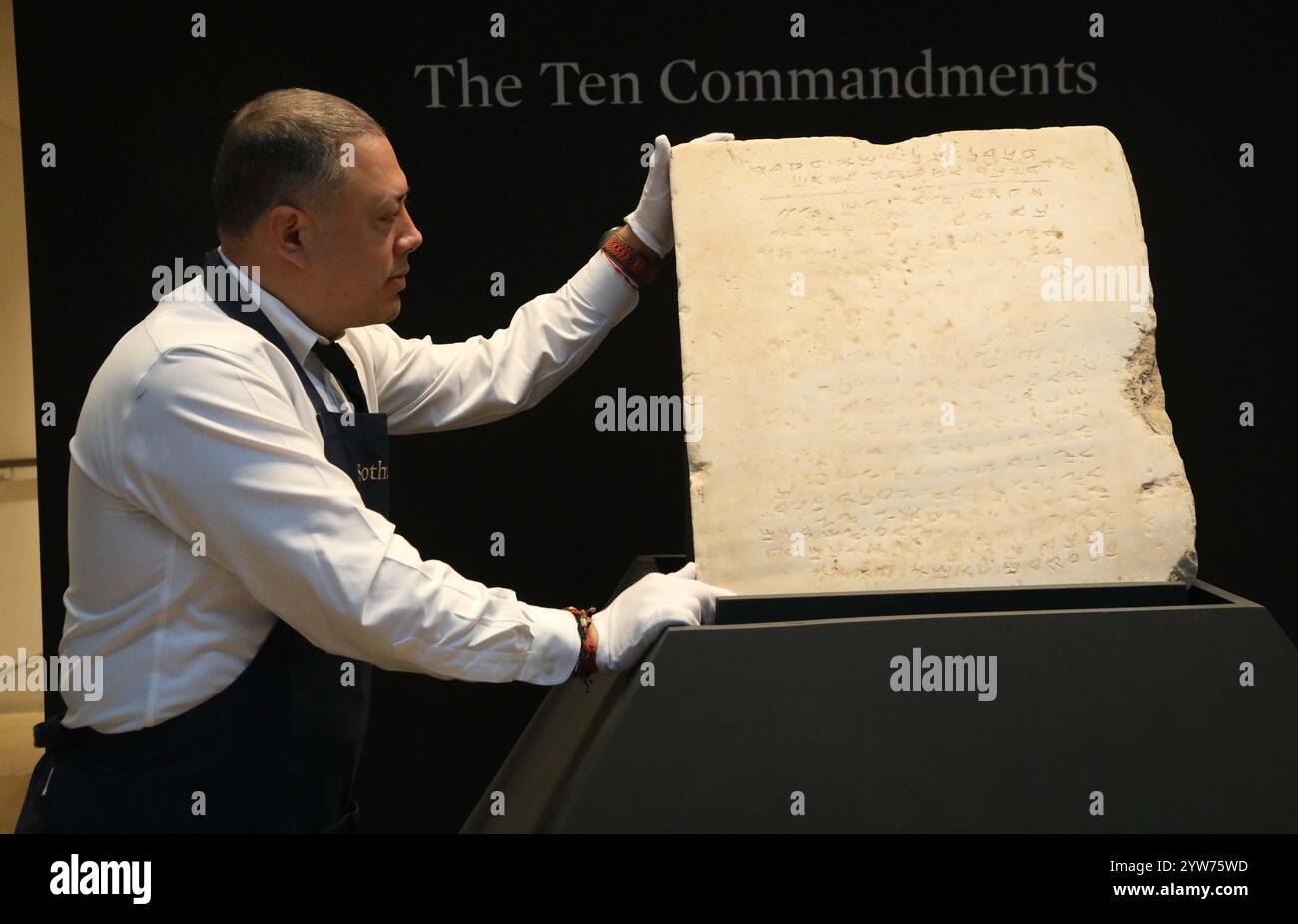 New York, New York, USA. 9th Dec, 2024. Sotheby's handler seen with The ...