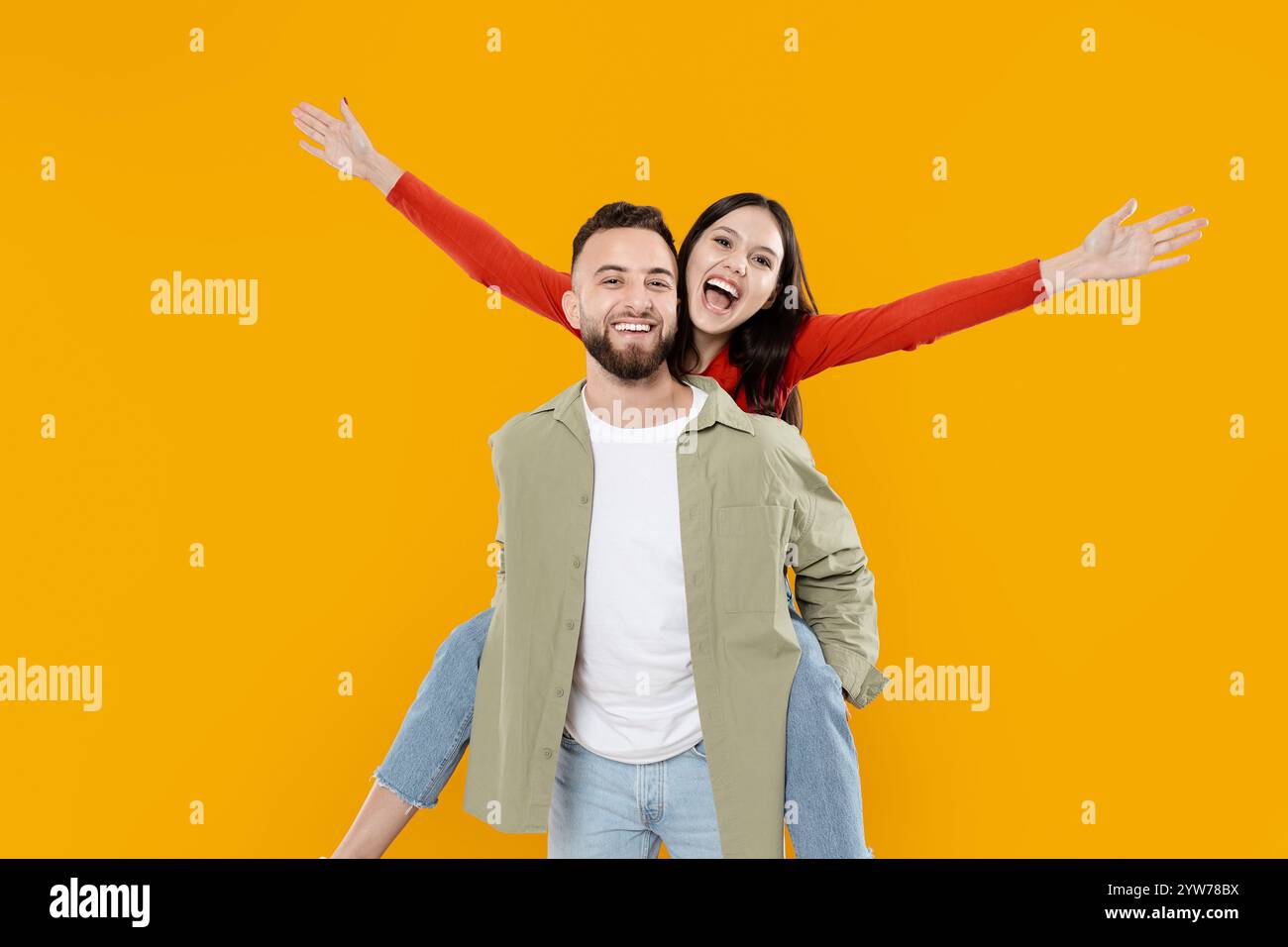 A joyful couple embraces the moment in a vibrant setting Stock Photo ...