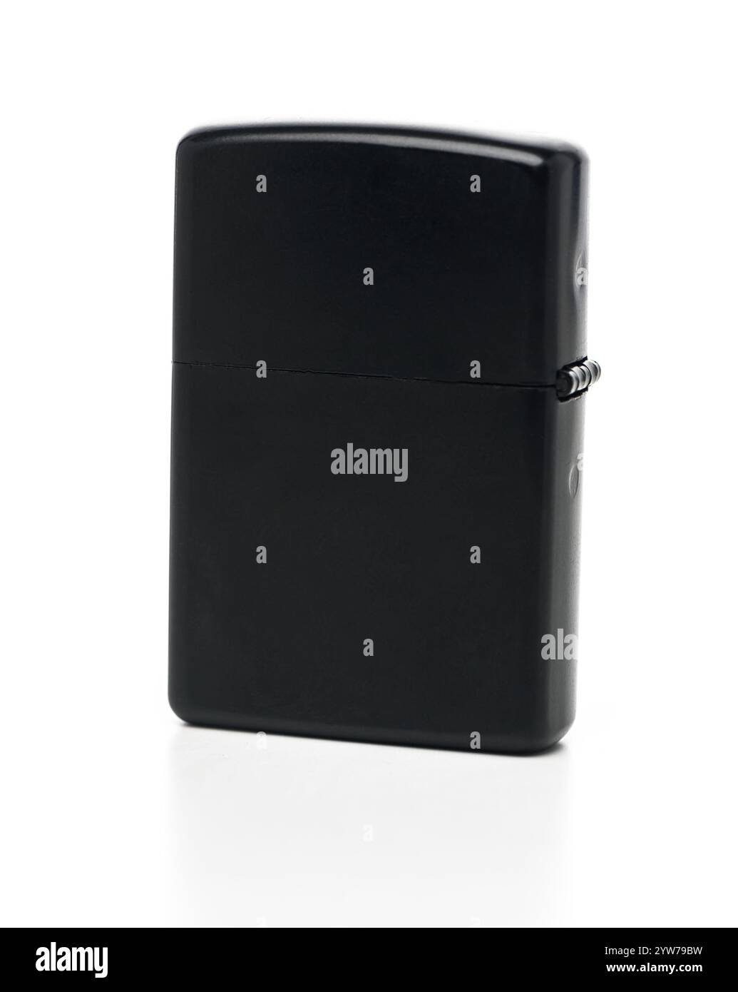 A sleek black lighter stands out against a bright surface, showcasing ...