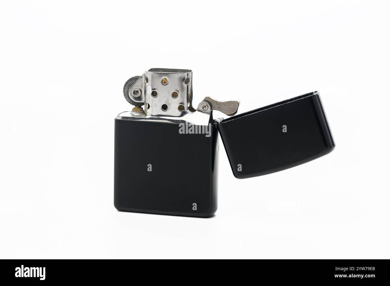 A classic metal lighter sits with its lid open, showcasing a sleek ...