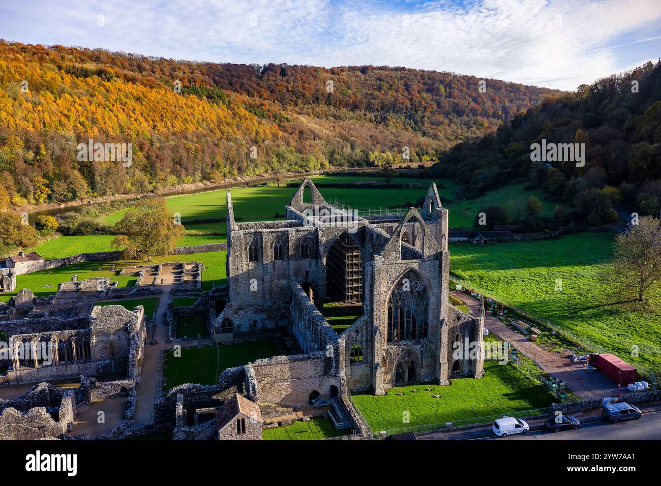 Aerial view of the ruins of Tintern Abbey surrounded by spectacular ...
