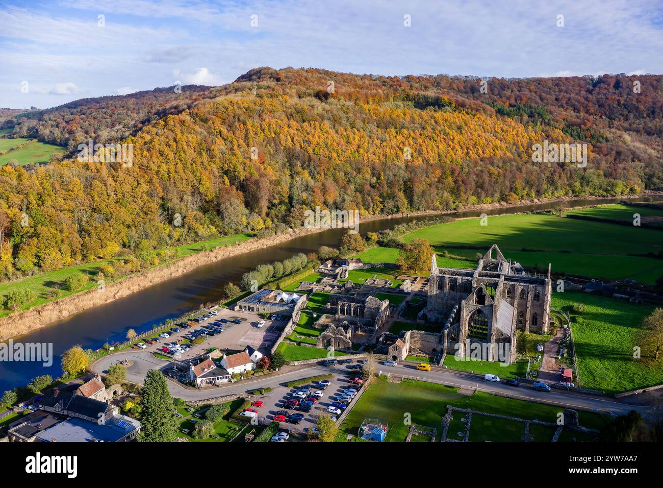 Aerial view of the ruins of Tintern Abbey surrounded by spectacular ...