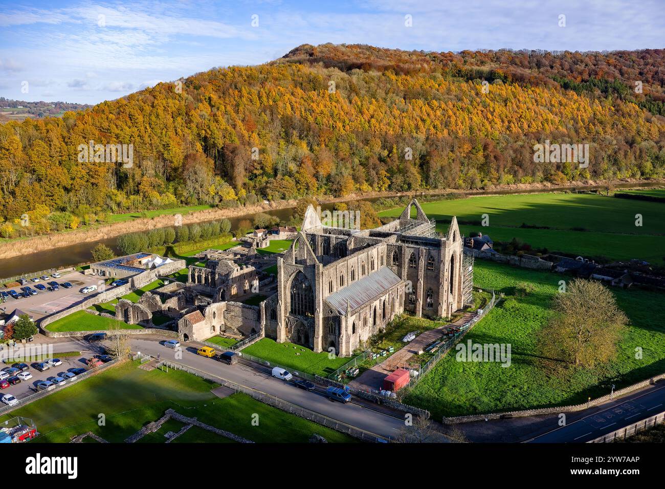 Aerial view of the ruins of Tintern Abbey surrounded by spectacular ...