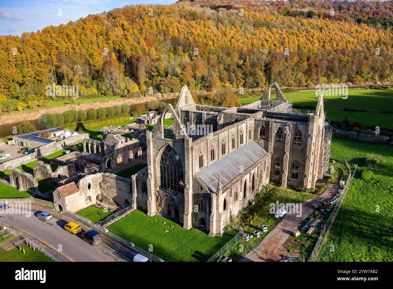Aerial view of the ruins of Tintern Abbey surrounded by spectacular ...