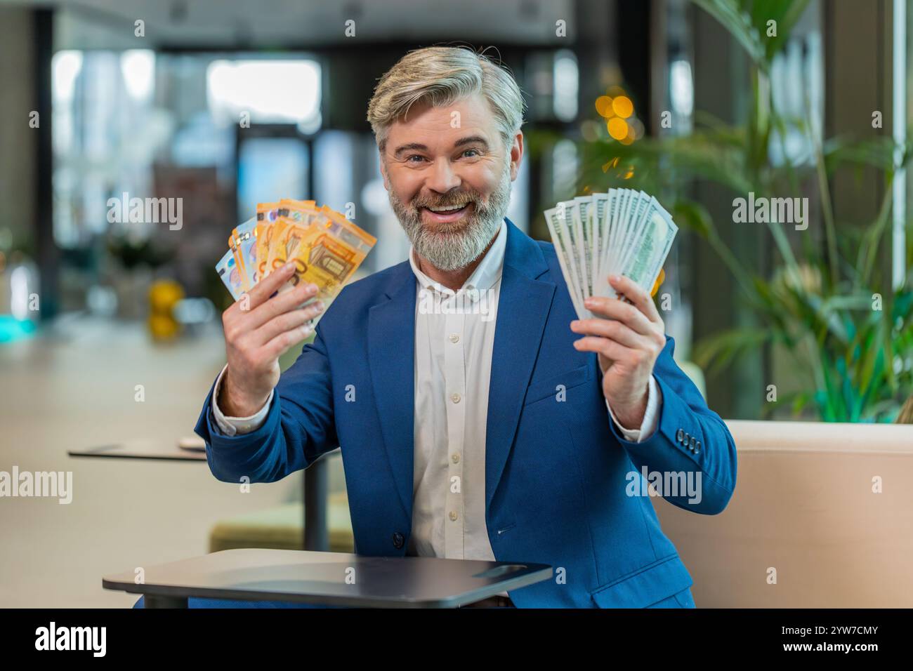 Mature businessman counting showing cash money dollar and euro ...