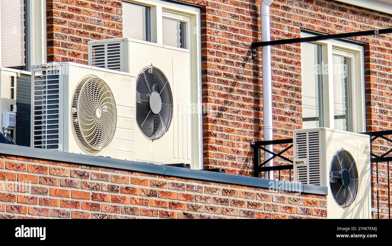 close up of an air source heat pump unit installed outdoors at a modern ...