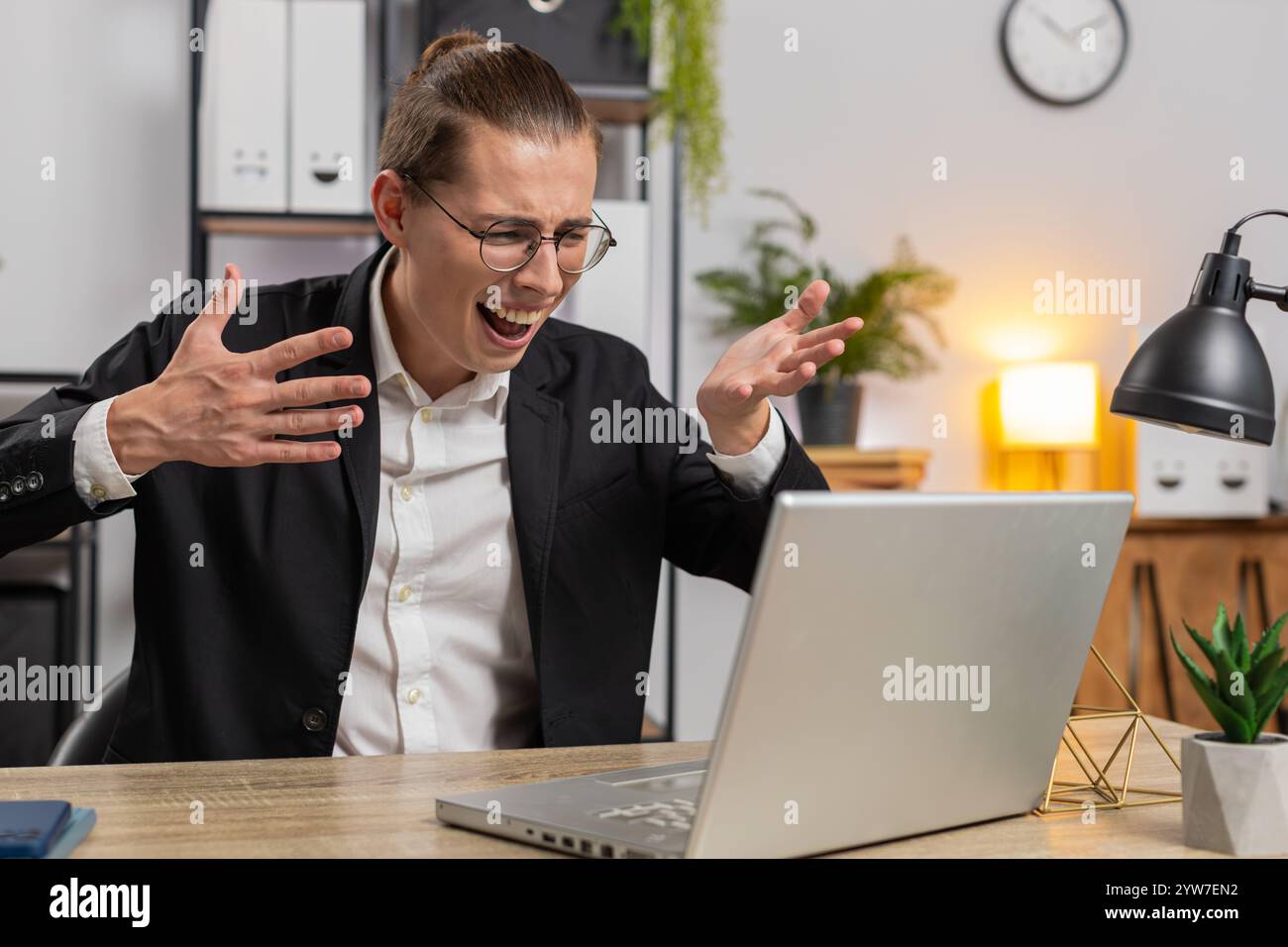 Nervous Caucasian manager quarreling laptop call online at home office ...