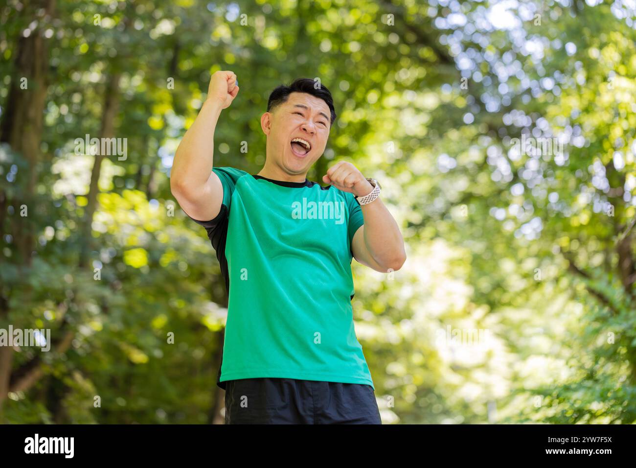 Athletic fit runner guy celebrate success win scream rejoices triumph ...