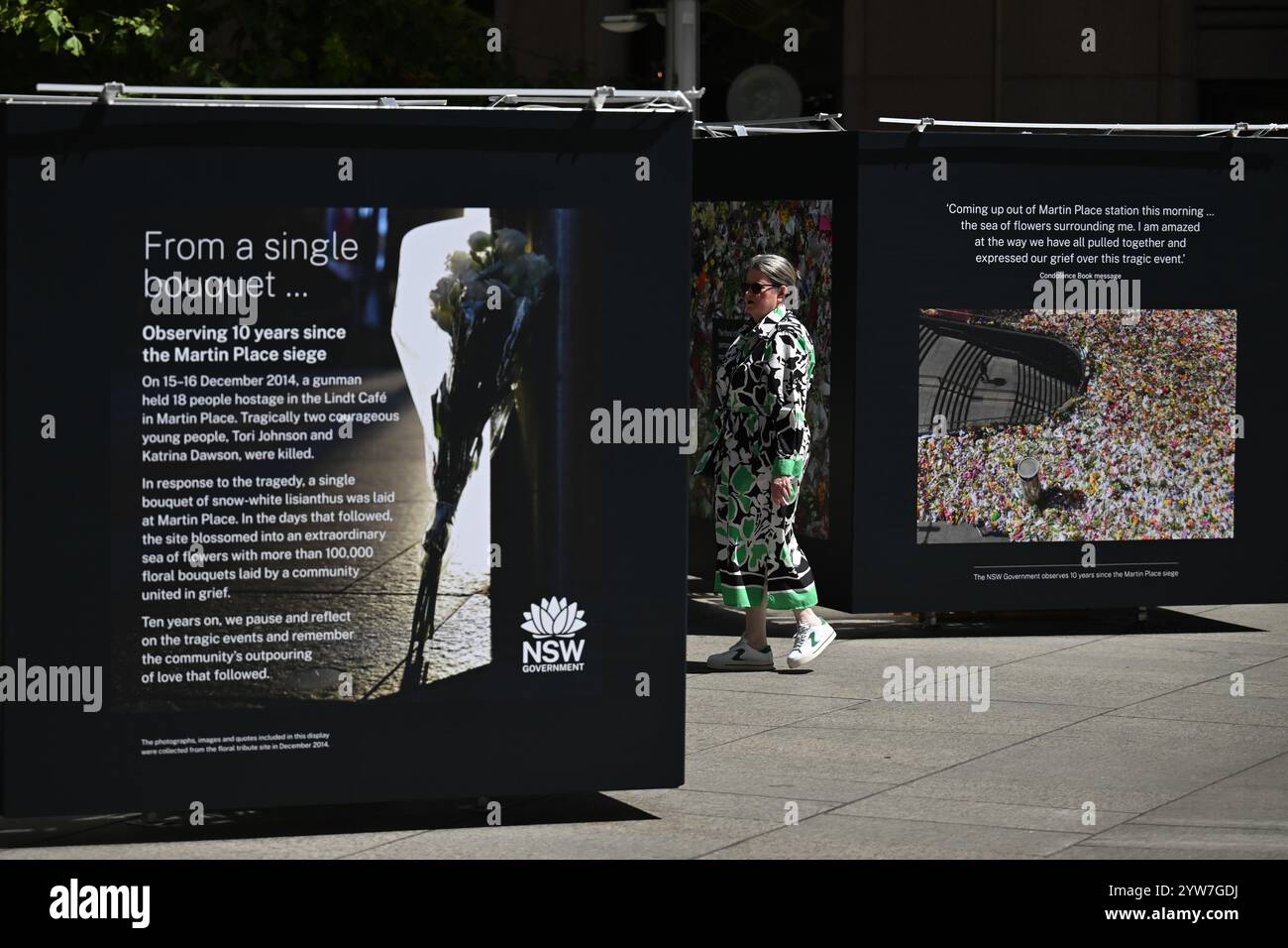 Shoppers view photo panels showing the massive floral tribute at a ...