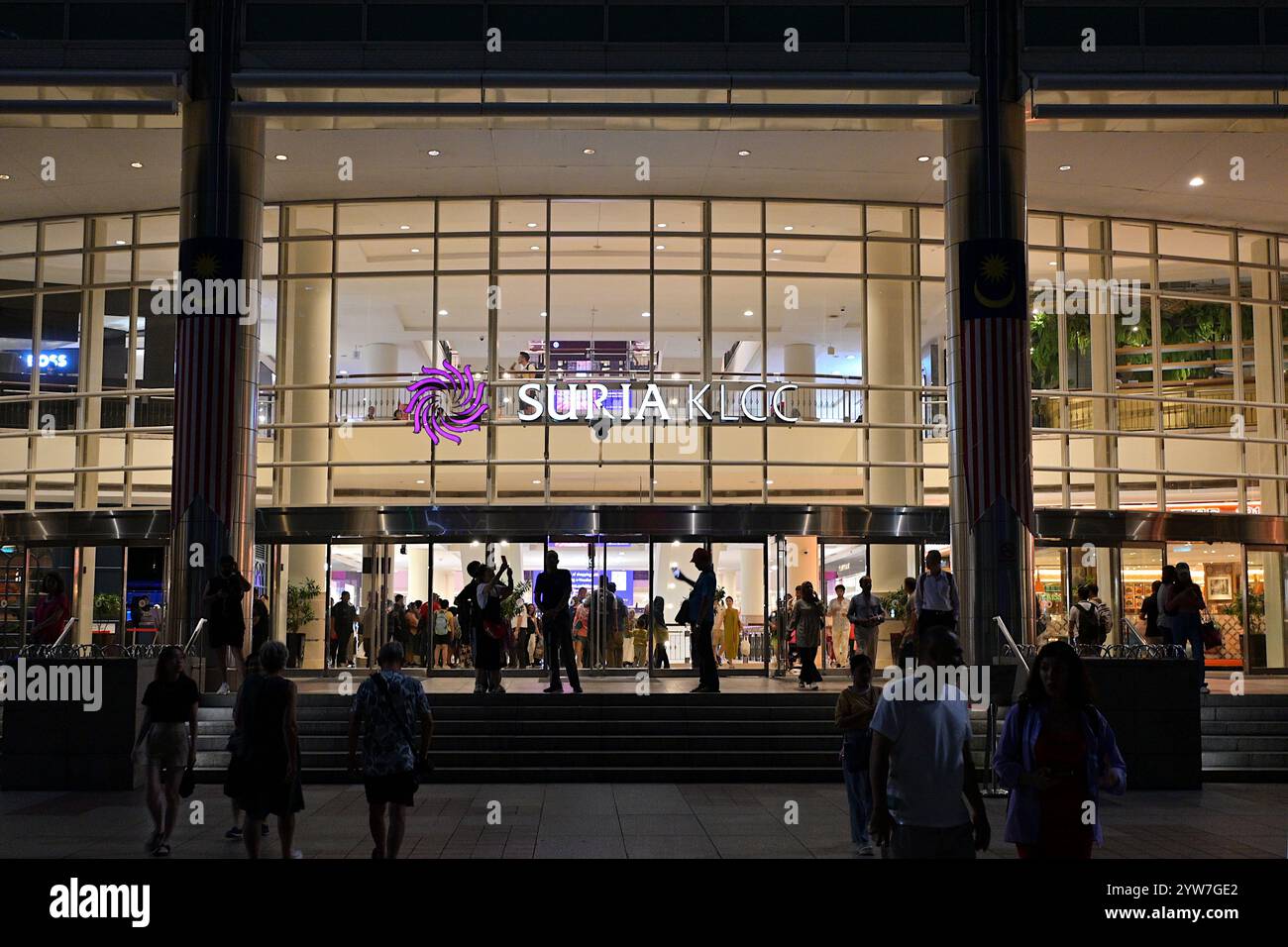 Evening crowd at main entrance of Suria KLCC, a premier shopping mall ...