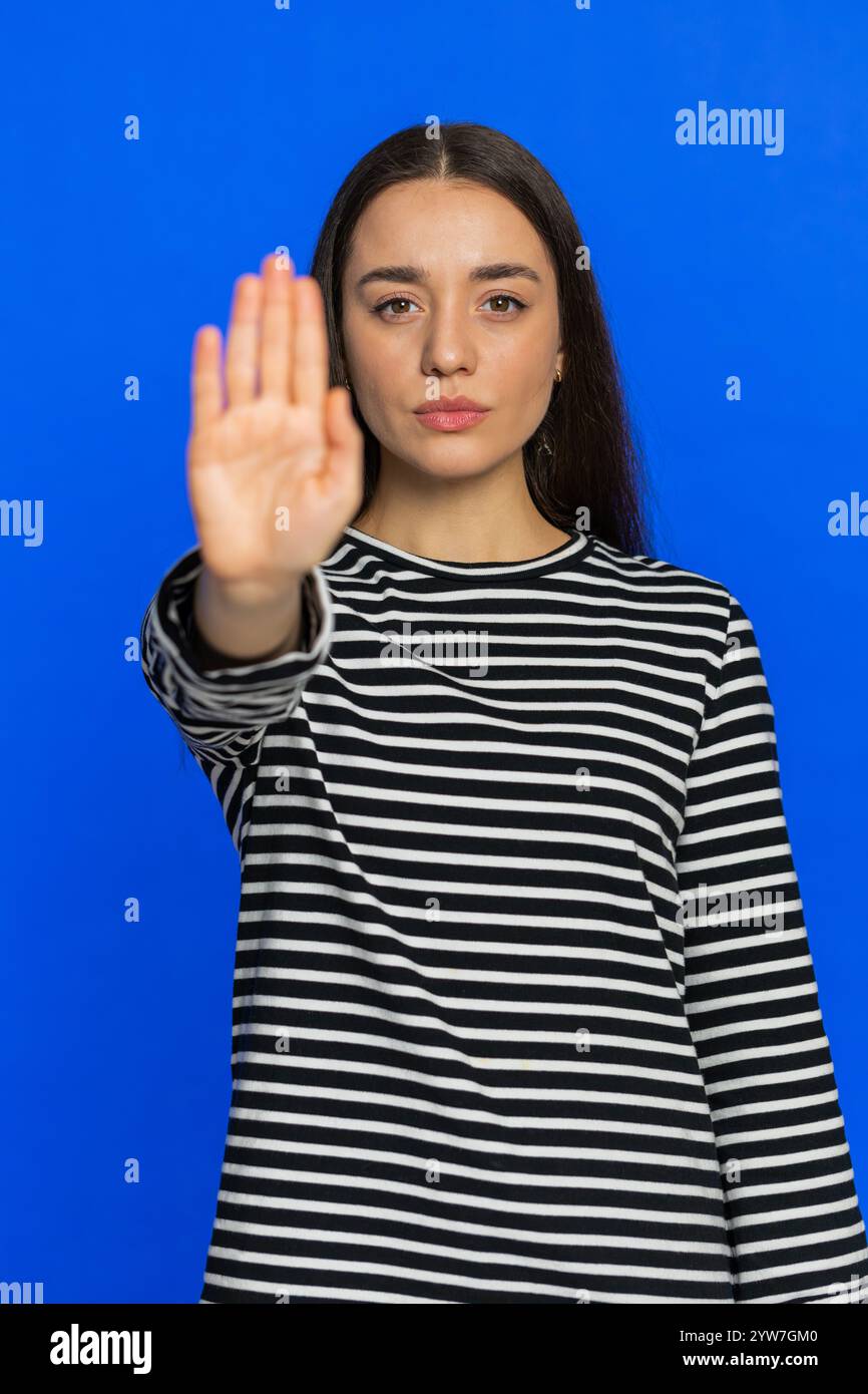 Stop, enough. Woman say no hold palm folded crossed hands in finish ...