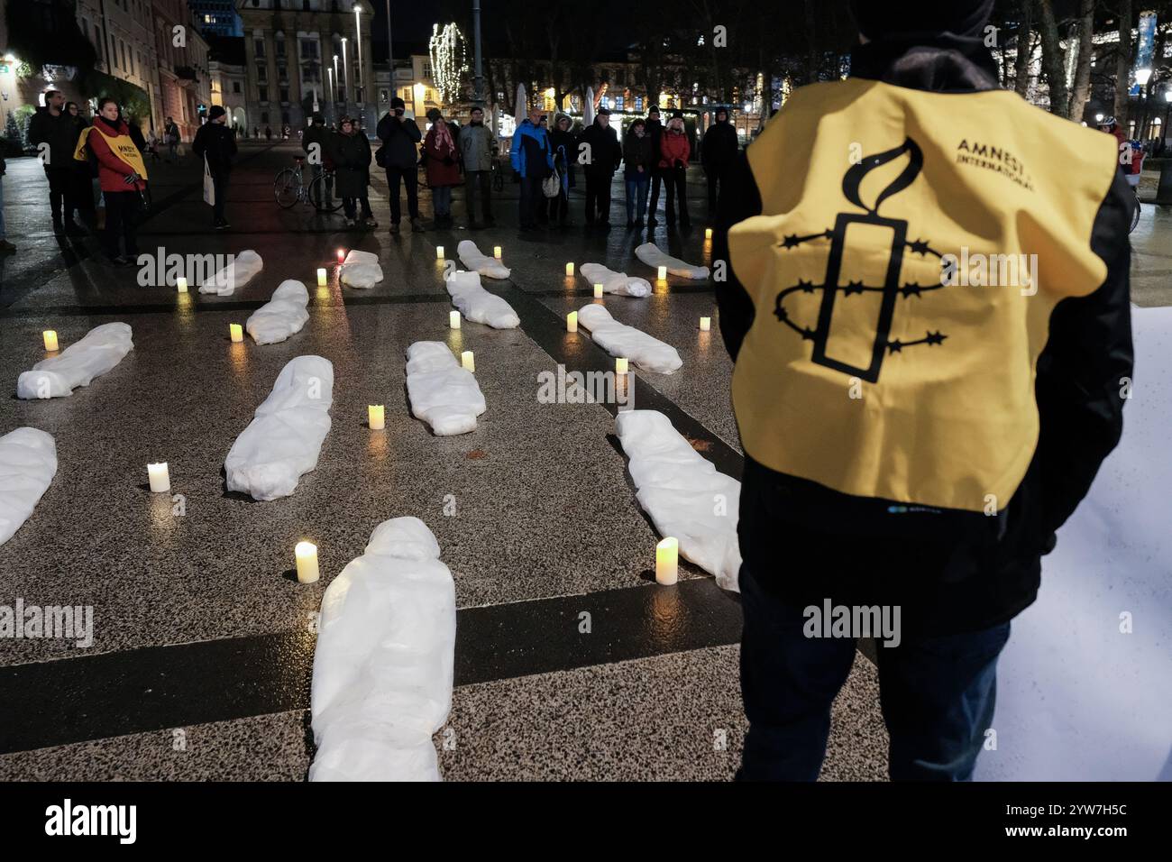 Ljubljana, Slovenia. 09th Dec, 2024. Candles and dummies of shrouded ...