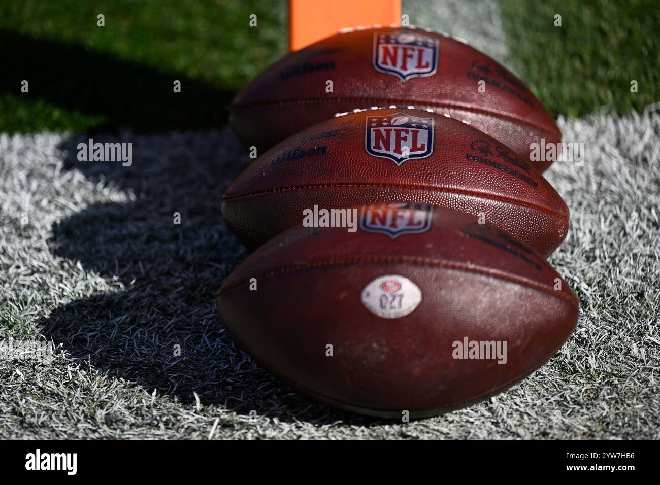 Footballs are shown before an NFL football game between the San ...