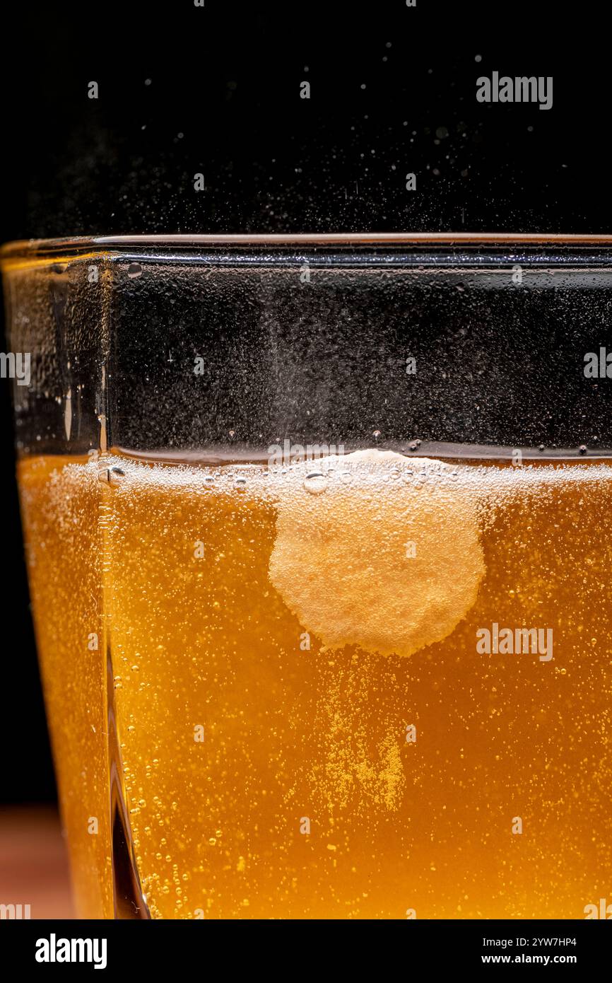 Effervescent Vitamin C Tablet Dissolving in Water Stock Photo - Alamy