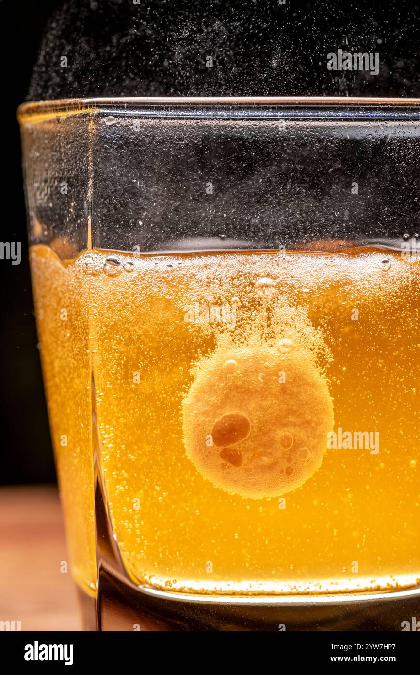 Effervescent Vitamin C Tablet Dissolving in Water Stock Photo - Alamy