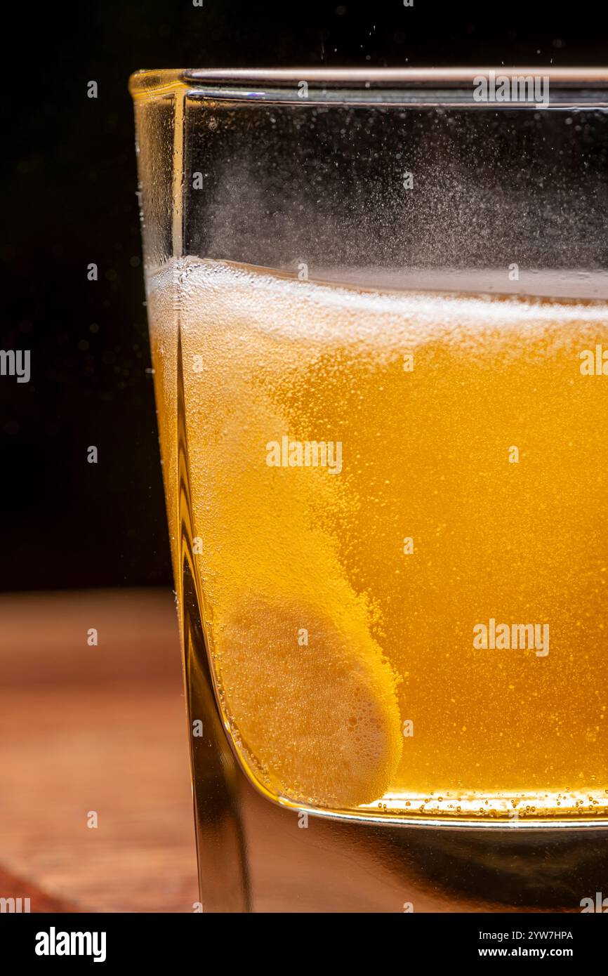 Effervescent Vitamin C Tablet Dissolving in Water Stock Photo - Alamy