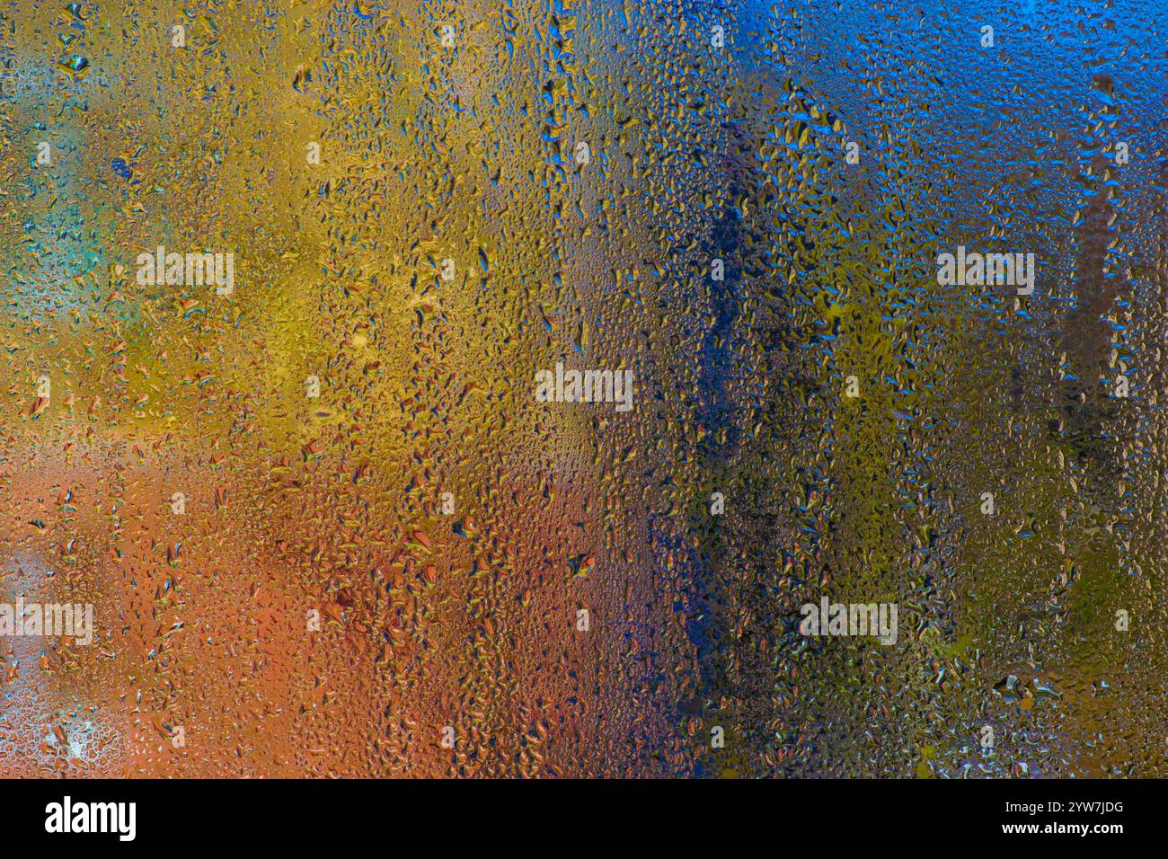 colored background of water droplets. condensation on the glass Stock ...