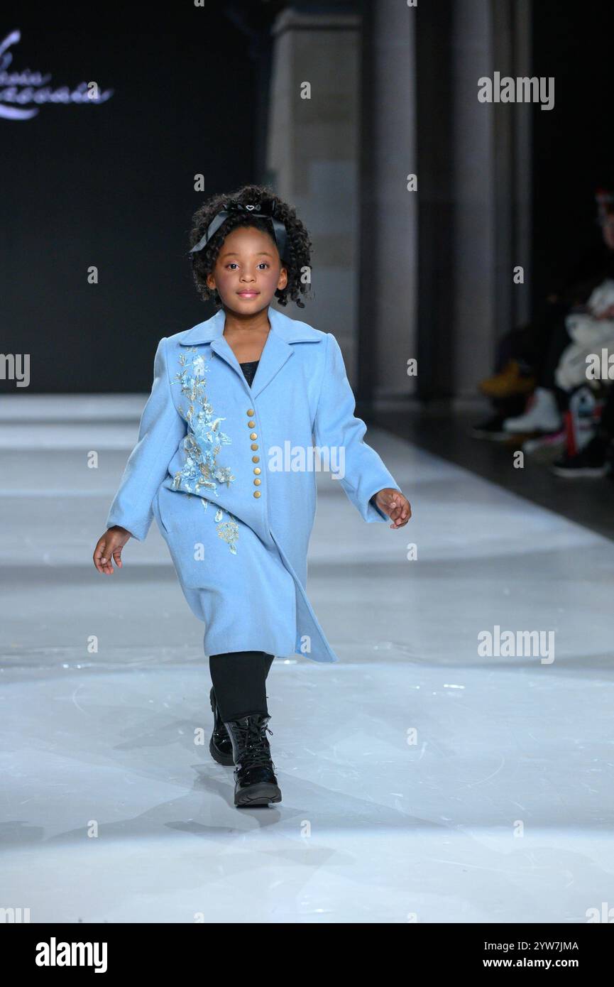 Toronto, ON, Canada - December 7, 2024: A model walks the runway at the ...