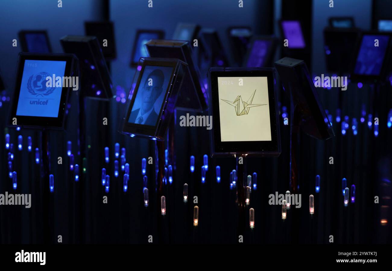 A golden panel of Folded paper cranes, a symbol of the Nihon Hidankyo ...