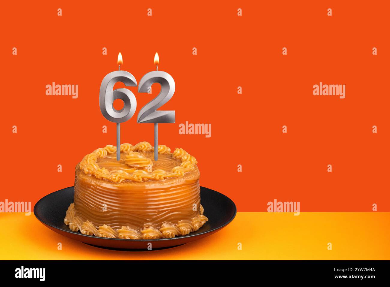 Birthday cake with dulce de leche frosting - Candle number 62 Stock ...