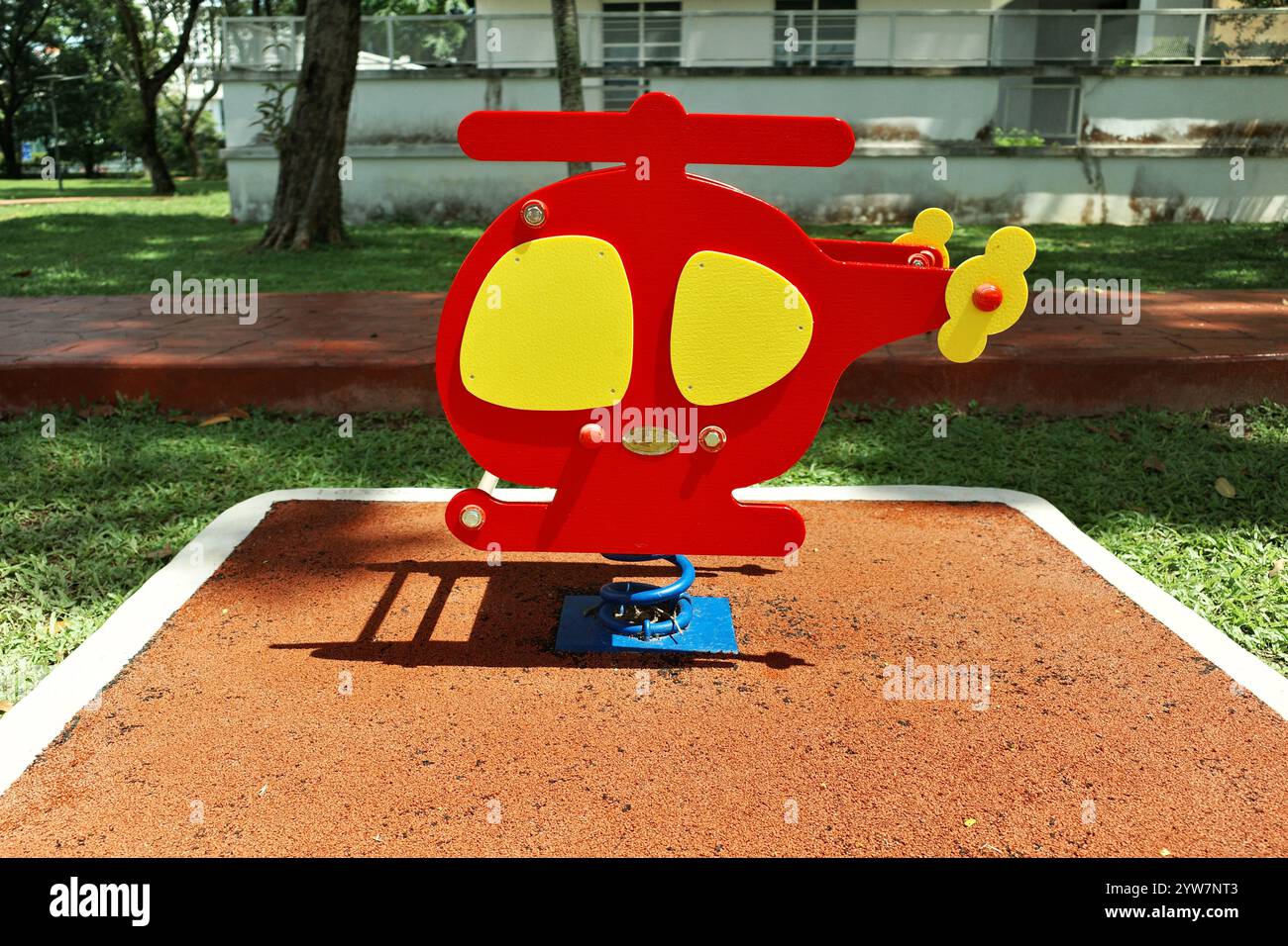 A helicopter shape children rocker in a public park at Malaysia Stock ...
