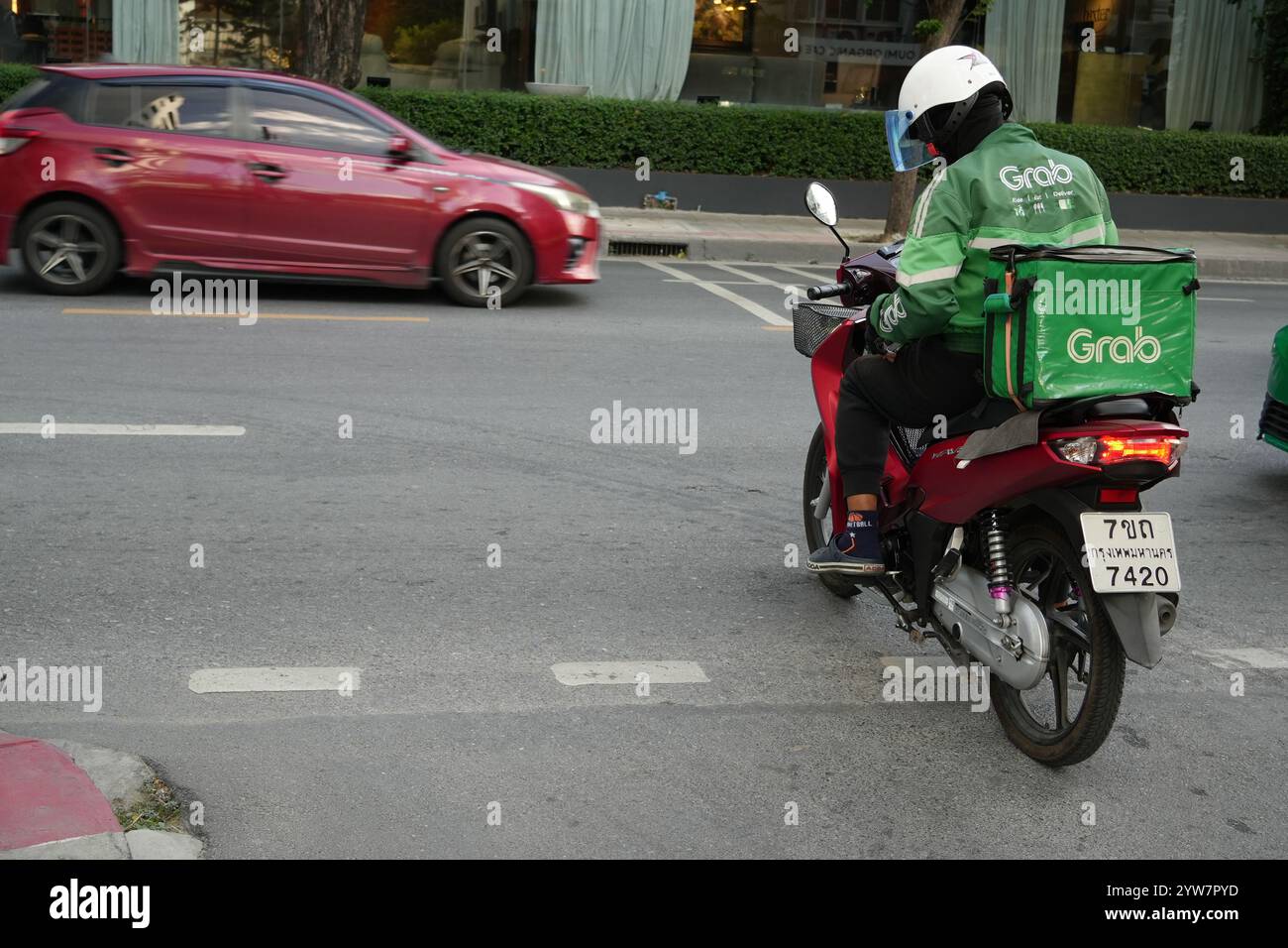 Bangkok, Thailand - November 26, 2024: Grab food man on his bike, is ...
