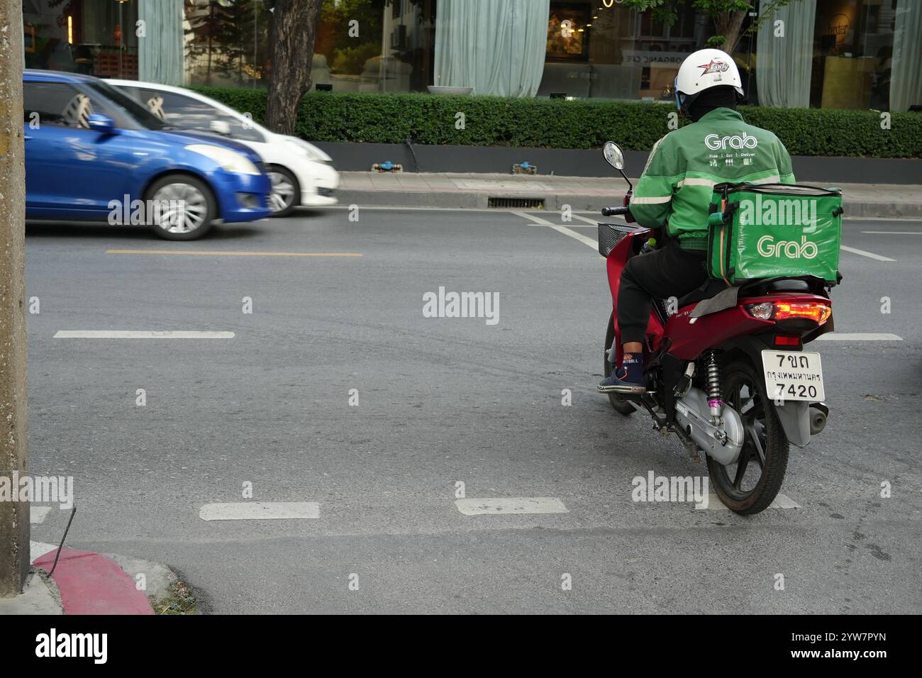 Bangkok, Thailand - November 26, 2024: Grab food man on his bike, is ...