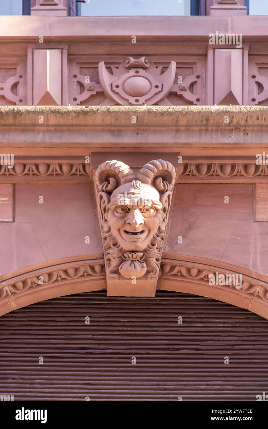 Ancient and scorched stone ornament with a demon face, Heidelberg ...