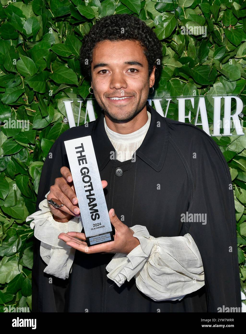 Actor Brandon Wilson poses with the breakthrough performer award for ...