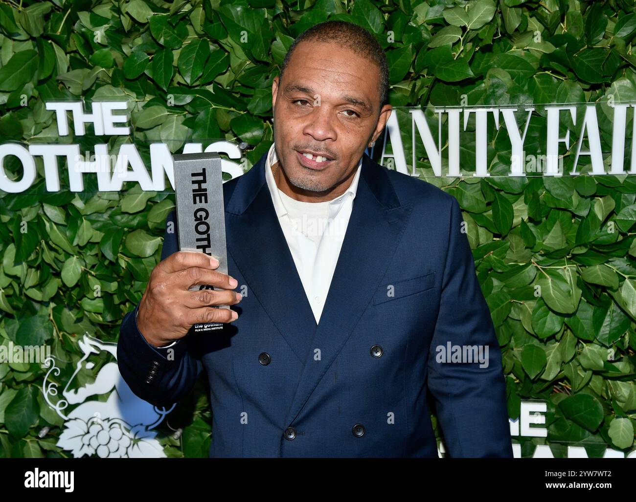 Clarence Maclin poses with the outstanding supporting performance award ...