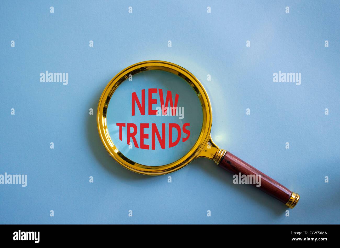 New Trends symbol. Magnifying glass with words New Trends. Beautiful ...
