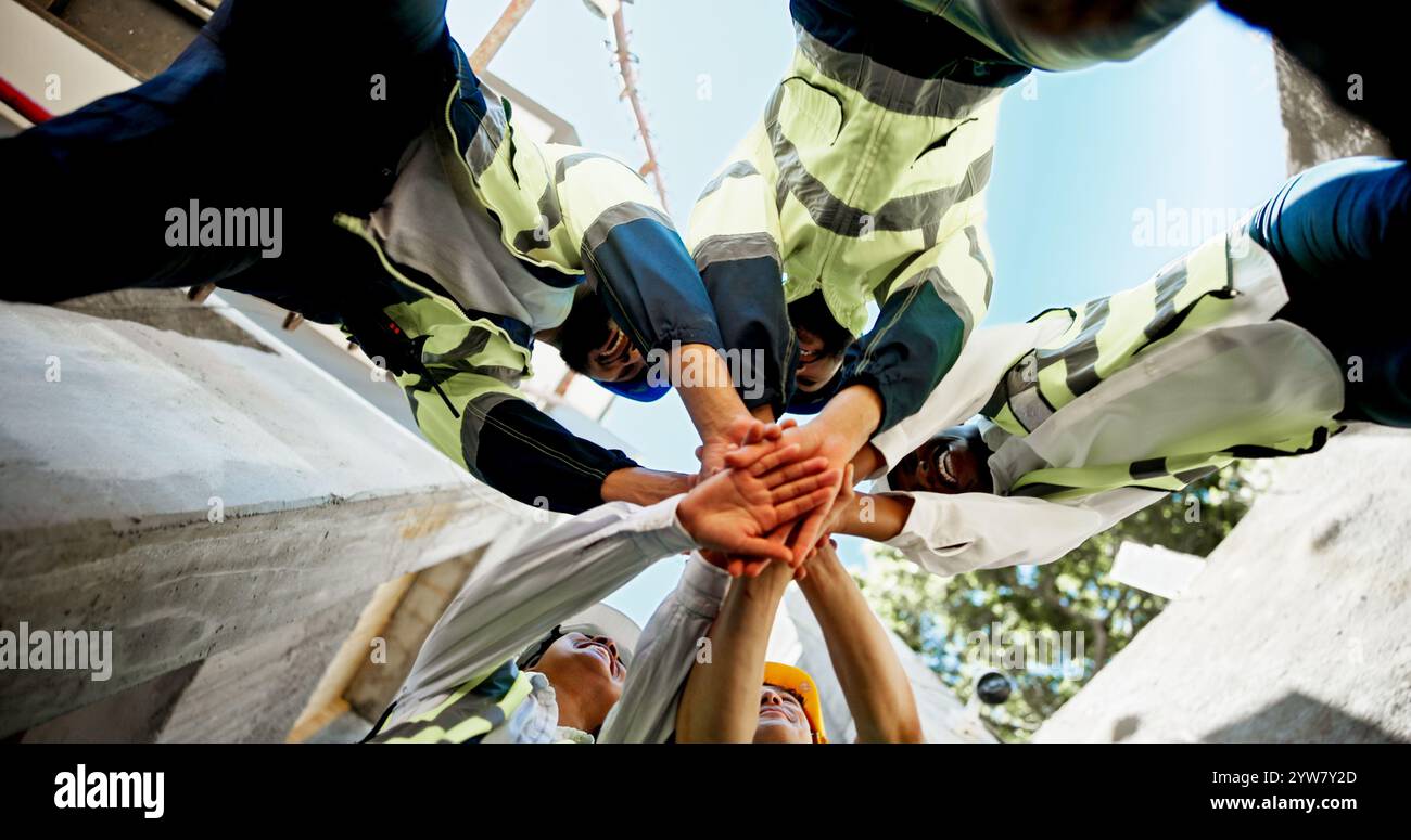 Construction, teamwork and hands together on site for support with ...