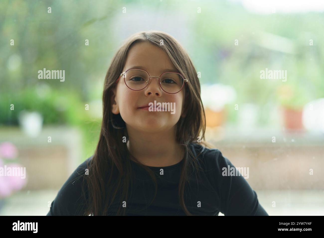 Little cute smiling girl with all her teeth in front of a big ...