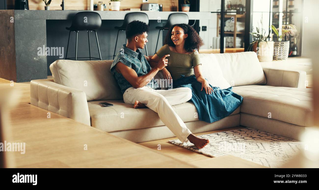 Happy couple, smile and talking in living room in bonding together ...
