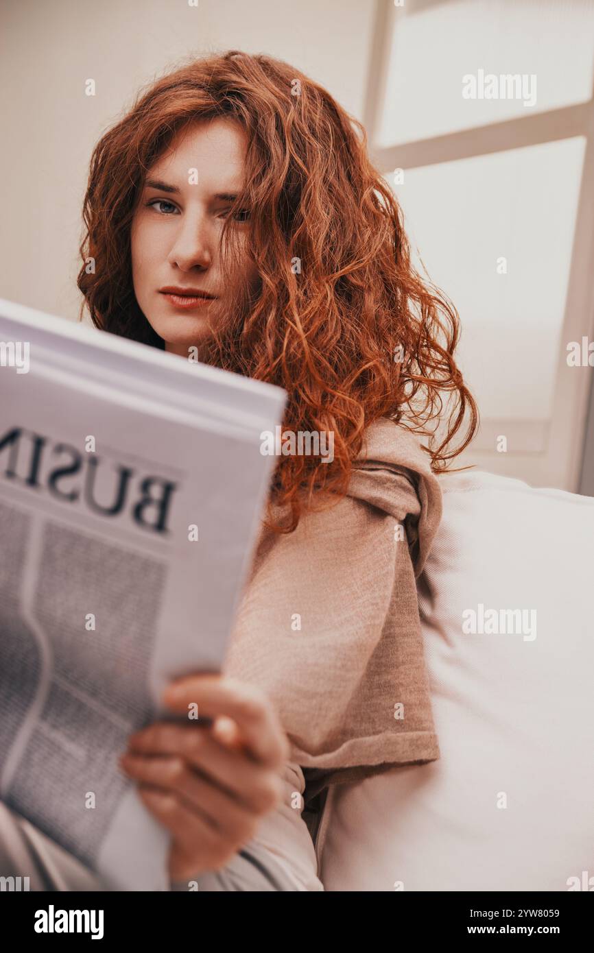 Woman sitting comfortably on bed hi-res stock photography and images ...