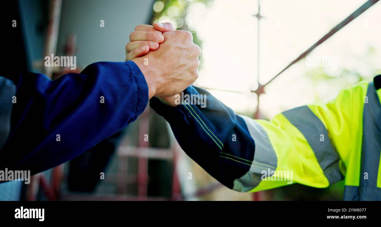 Engineering, closeup and business people with handshake, partnership ...