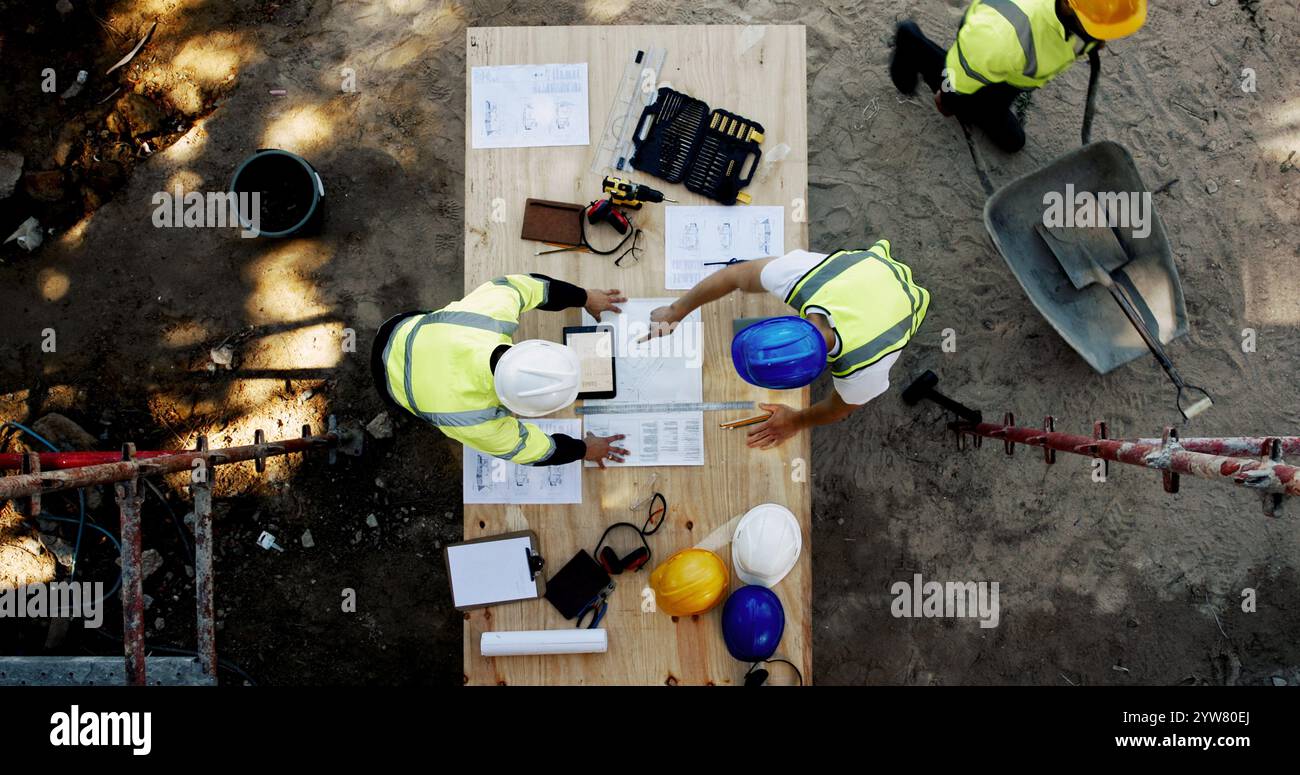 Blueprint, construction and men at table with planning, collaboration ...