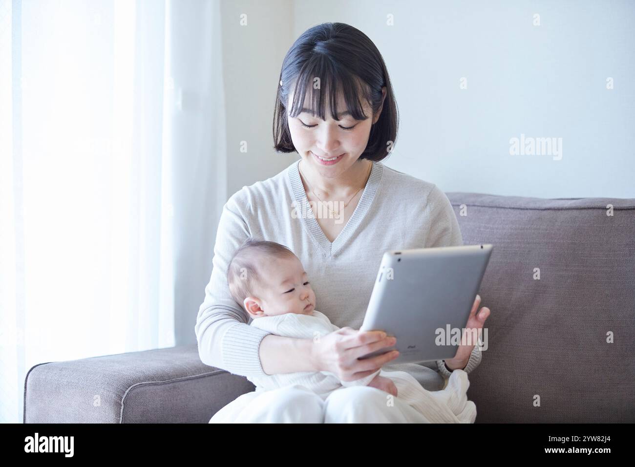 Child carrying tablet hi-res stock photography and images - Alamy
