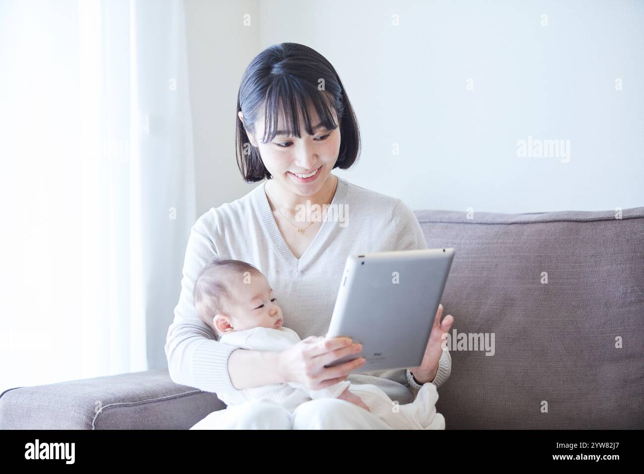 Child carrying tablet hi-res stock photography and images - Alamy