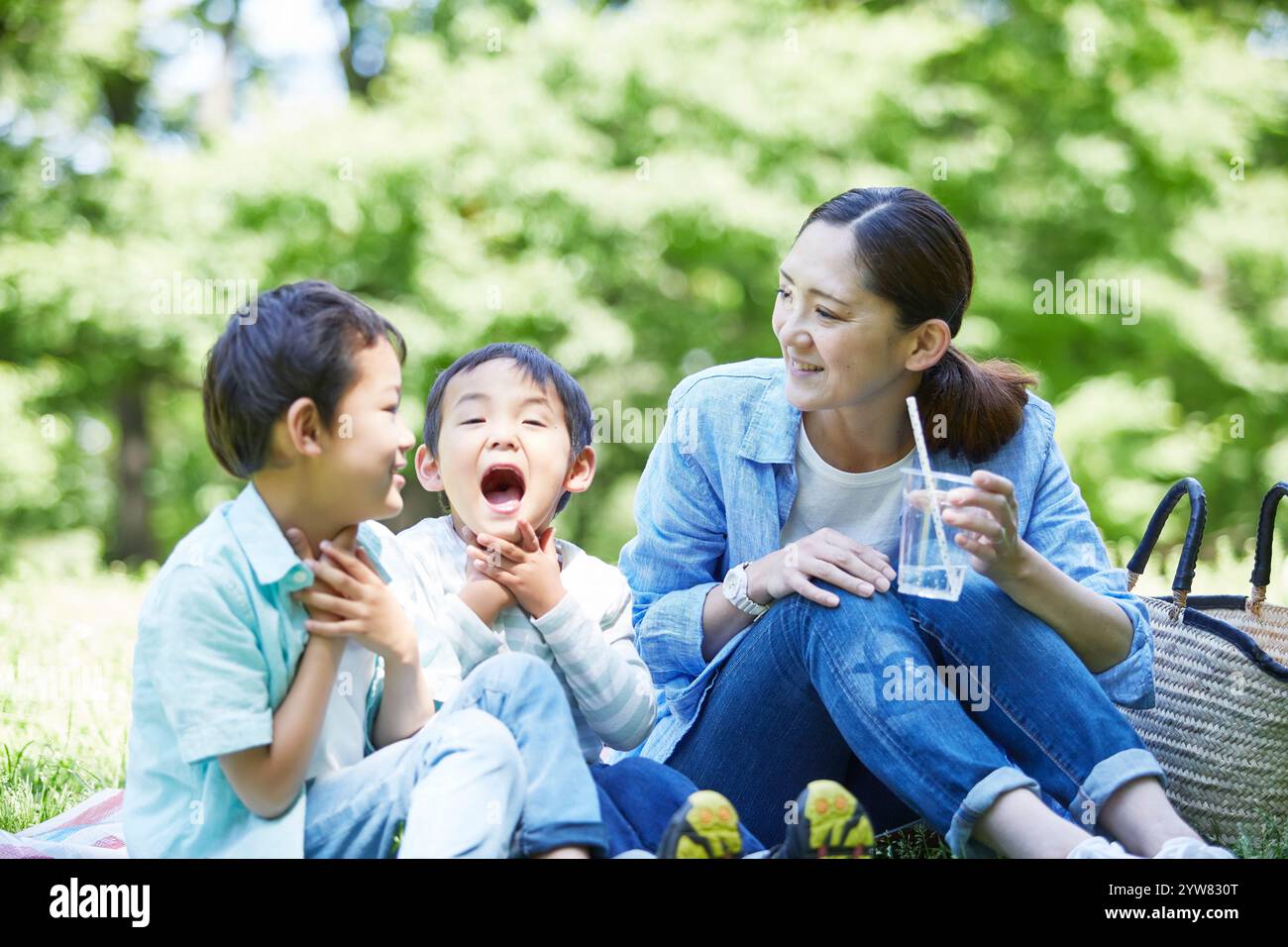 Parent and child playing outdoors Stock Photo - Alamy